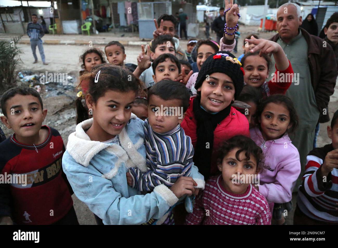 FILE - In this Monday, Dec. 14, 2015 photo, Iraqi children pose for a ...