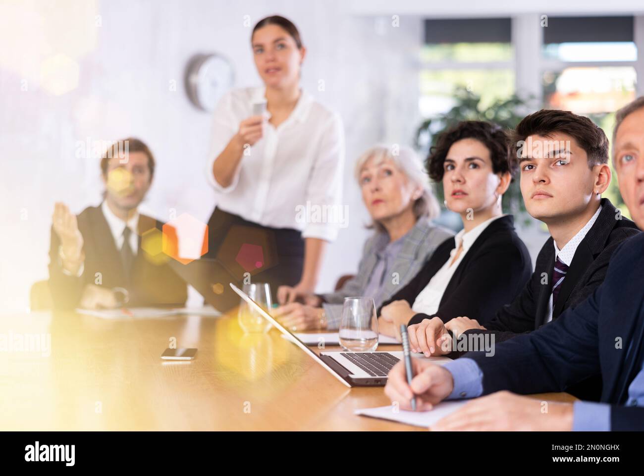 Group of business people attending meeting in conference room ...