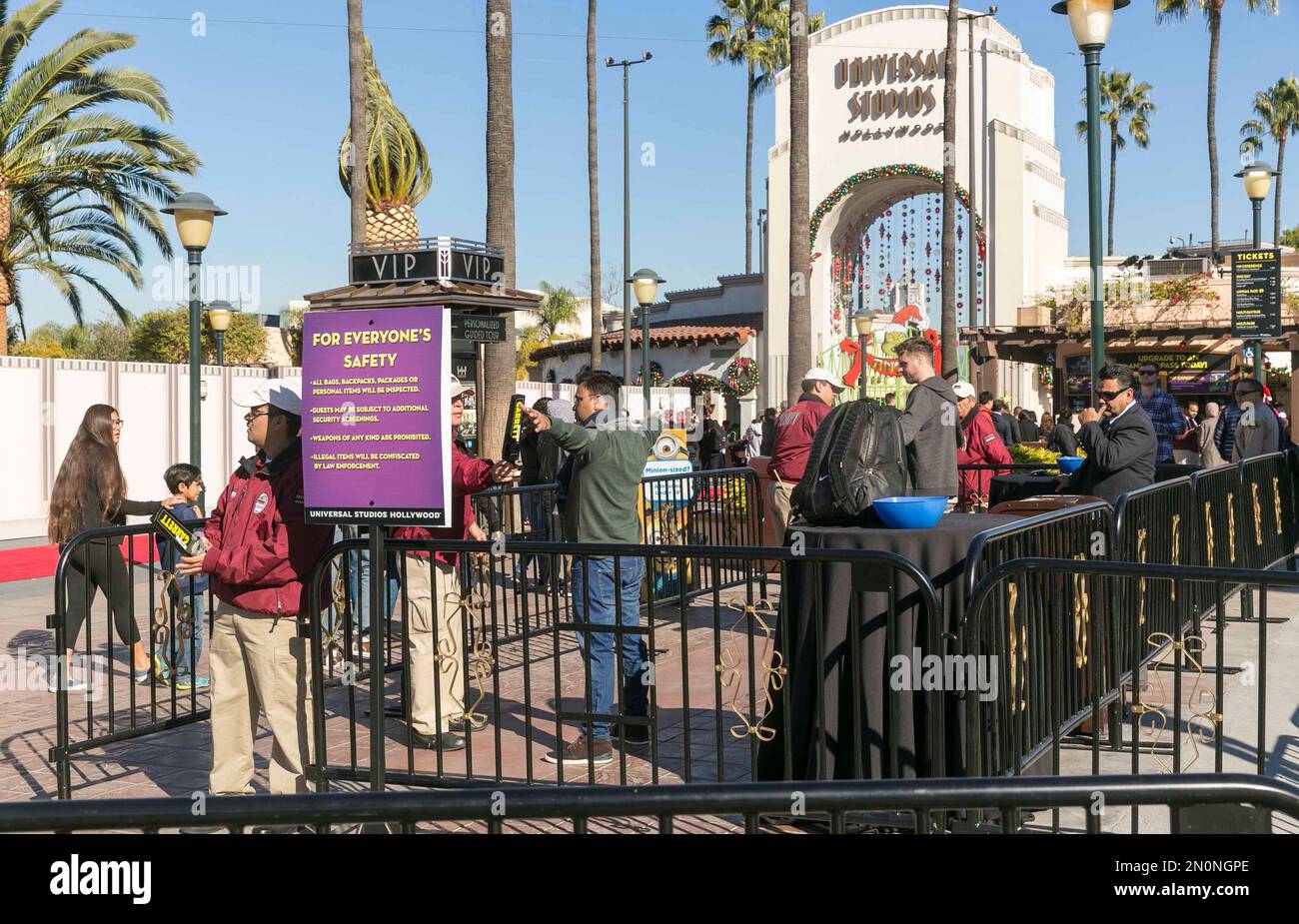 Visitors are searched at a security checkpoint outside Universal ...