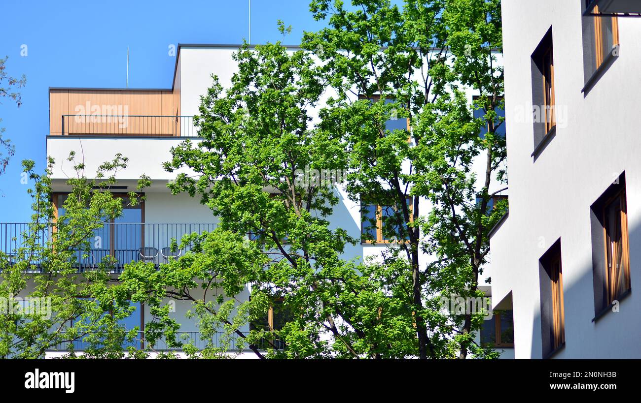 Modern residential building with new apartments in a green residential ...