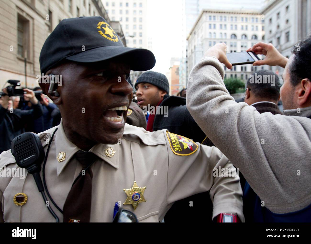 A demonstrator is detained by Baltimore sheriff officers, outside of ...