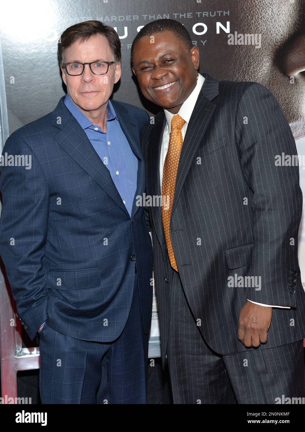 Sportscaster Bob Costa, left, and Dr. Bennet Omalu pose together at a ...