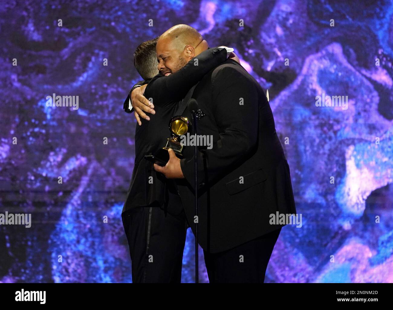Steven Feifke, left, and Bijon Watson accept the award for best large ...