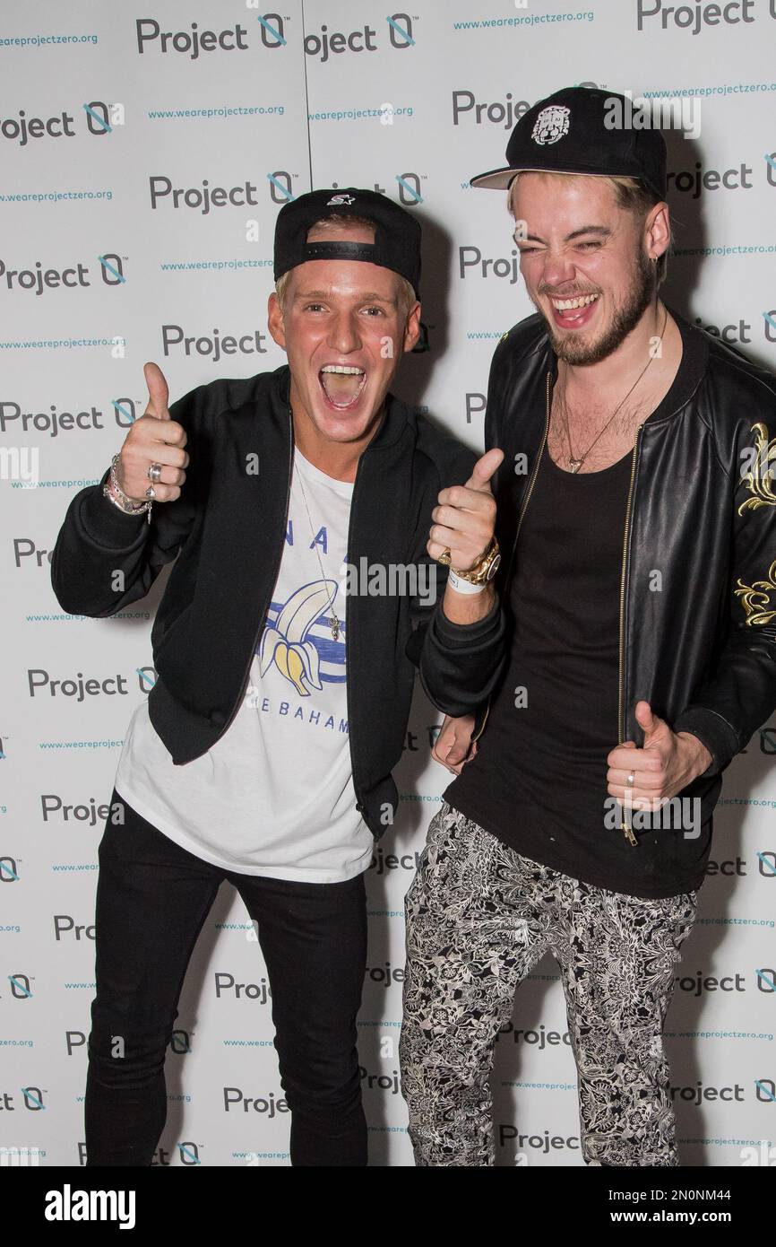 Jamie Lang and guest pose for photographers upon arrival at the Project ...