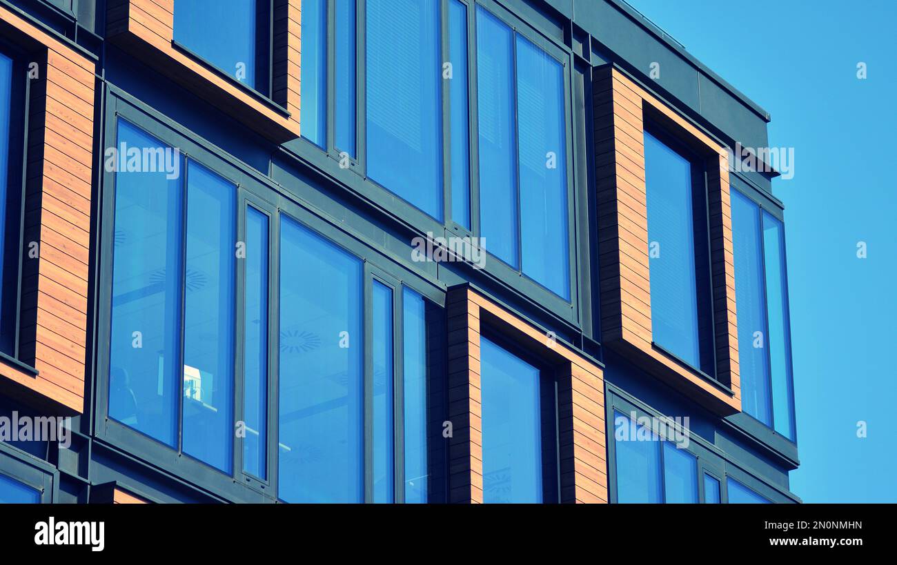Modern office building facade abstract fragment, shiny windows in steel ...