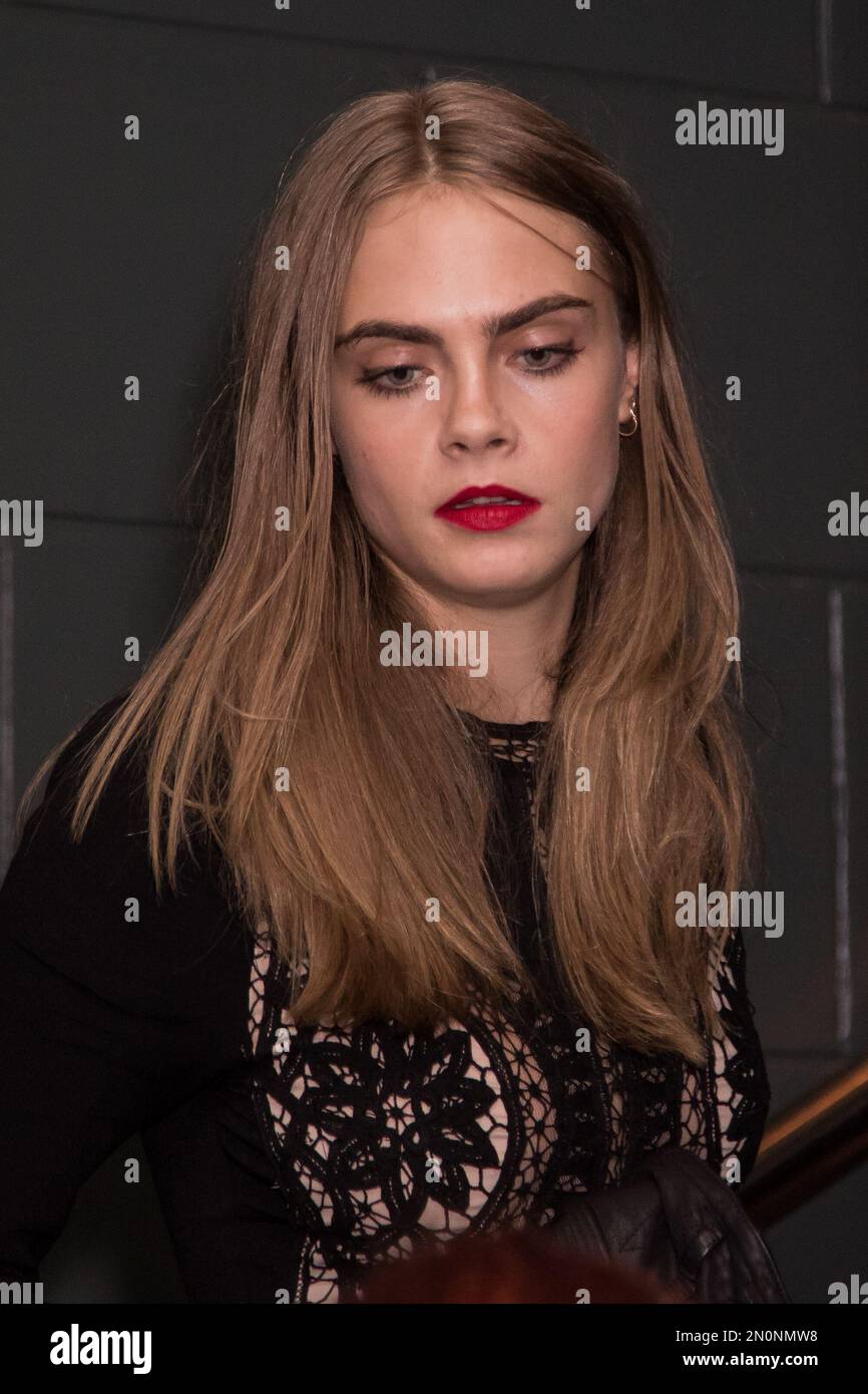Cara Delevingne poses for photographers upon arrival at the Project 0 ...