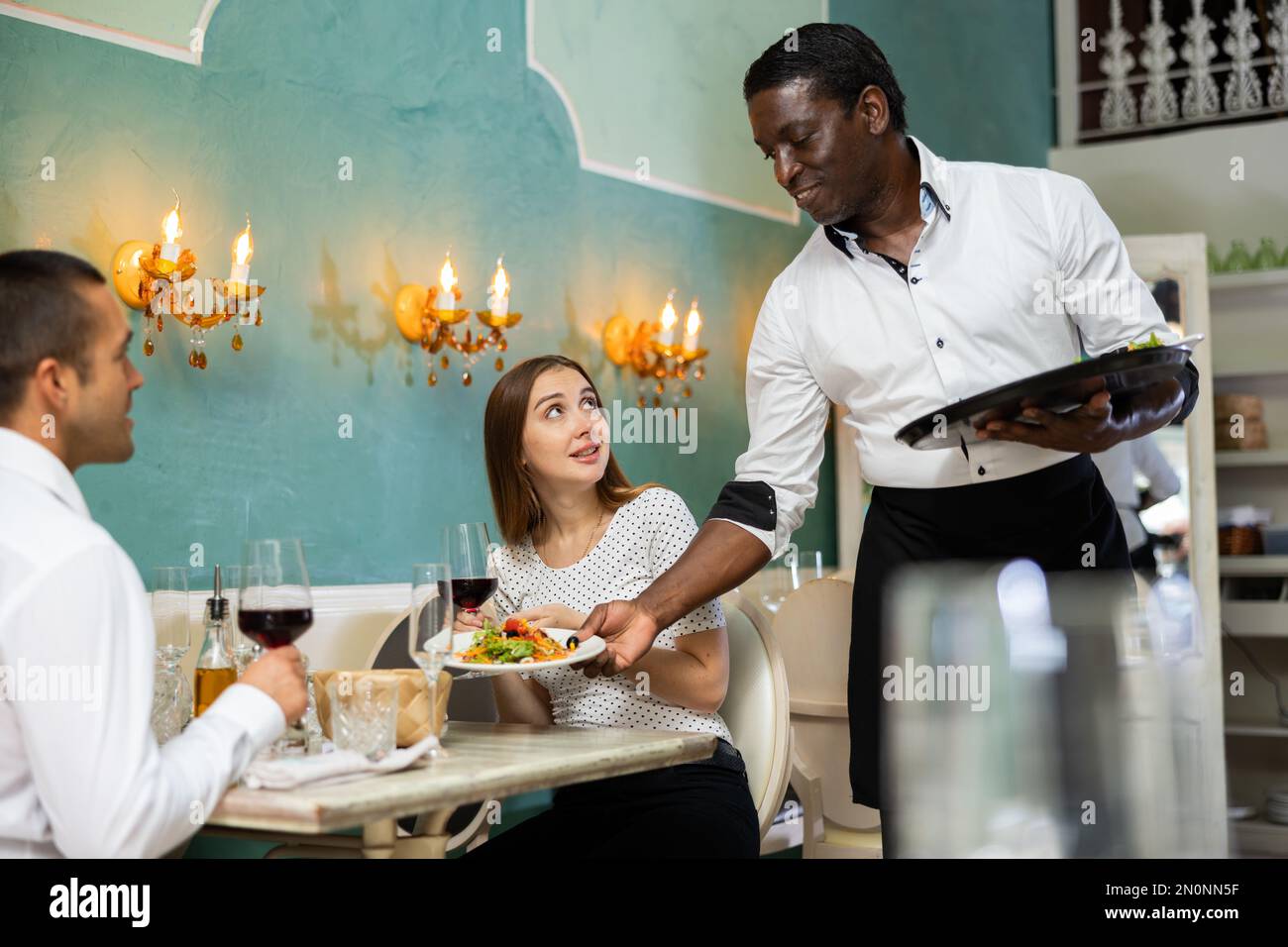 Couple offering food meal restaurant hi-res stock photography and ...