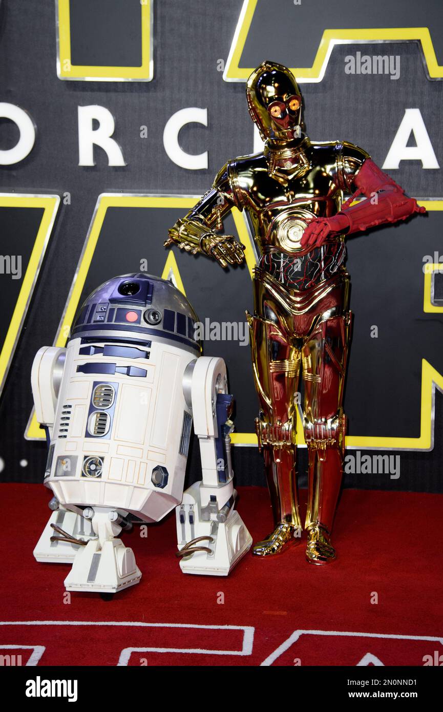 Actors dressed as C3PO and R2D2 pose for photographers upon arrival at ...