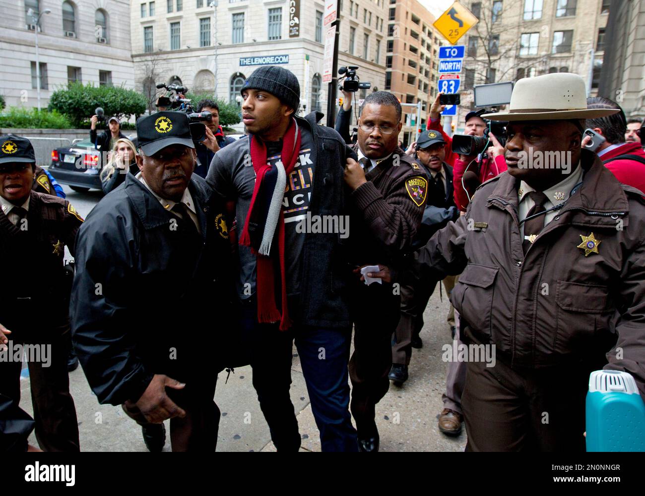 A demonstrator is detained outside of the courthouse after a mistrial ...