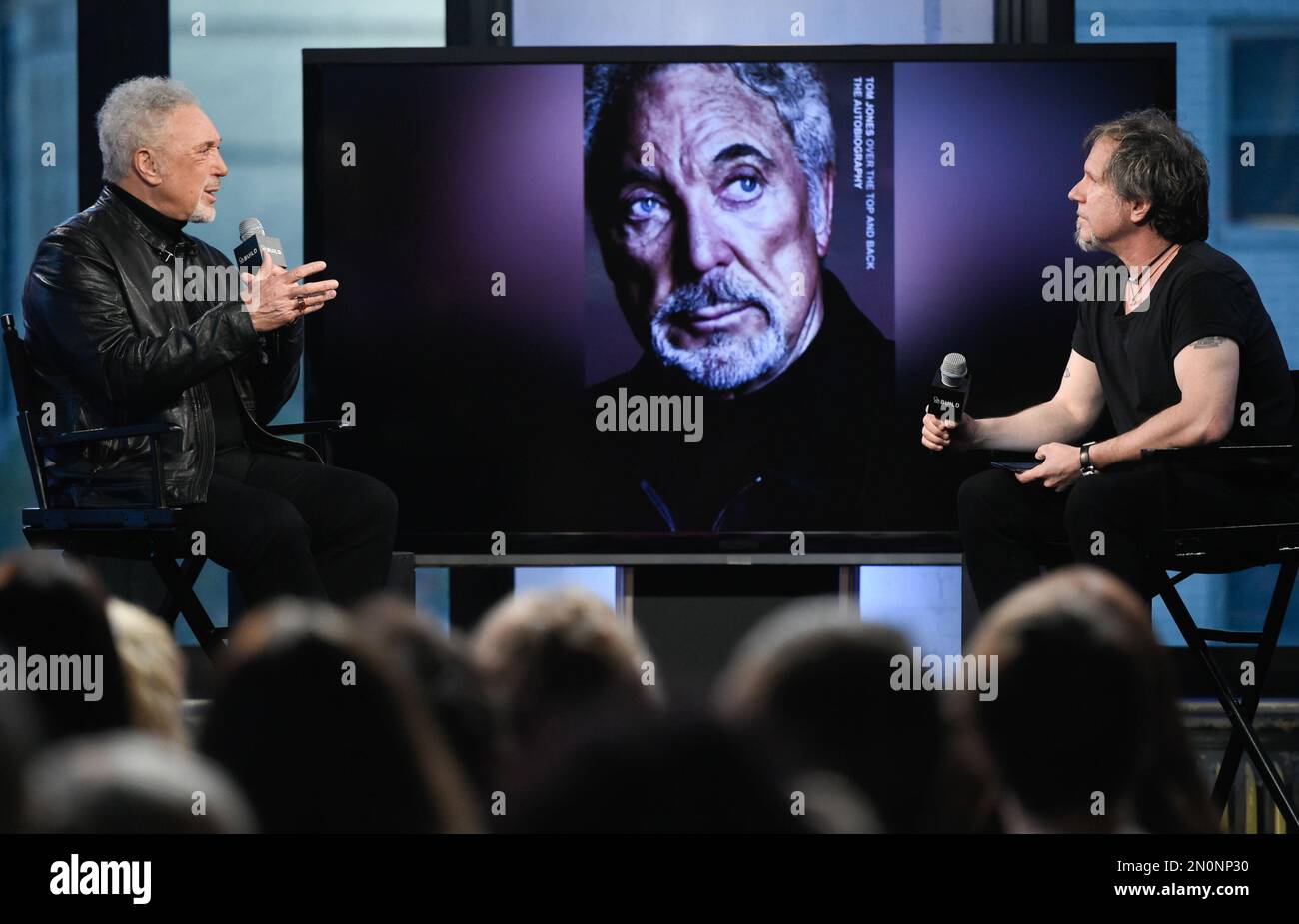 Singer Tom Jones, left, chats with moderator Brad Tolinski during AOL's ...