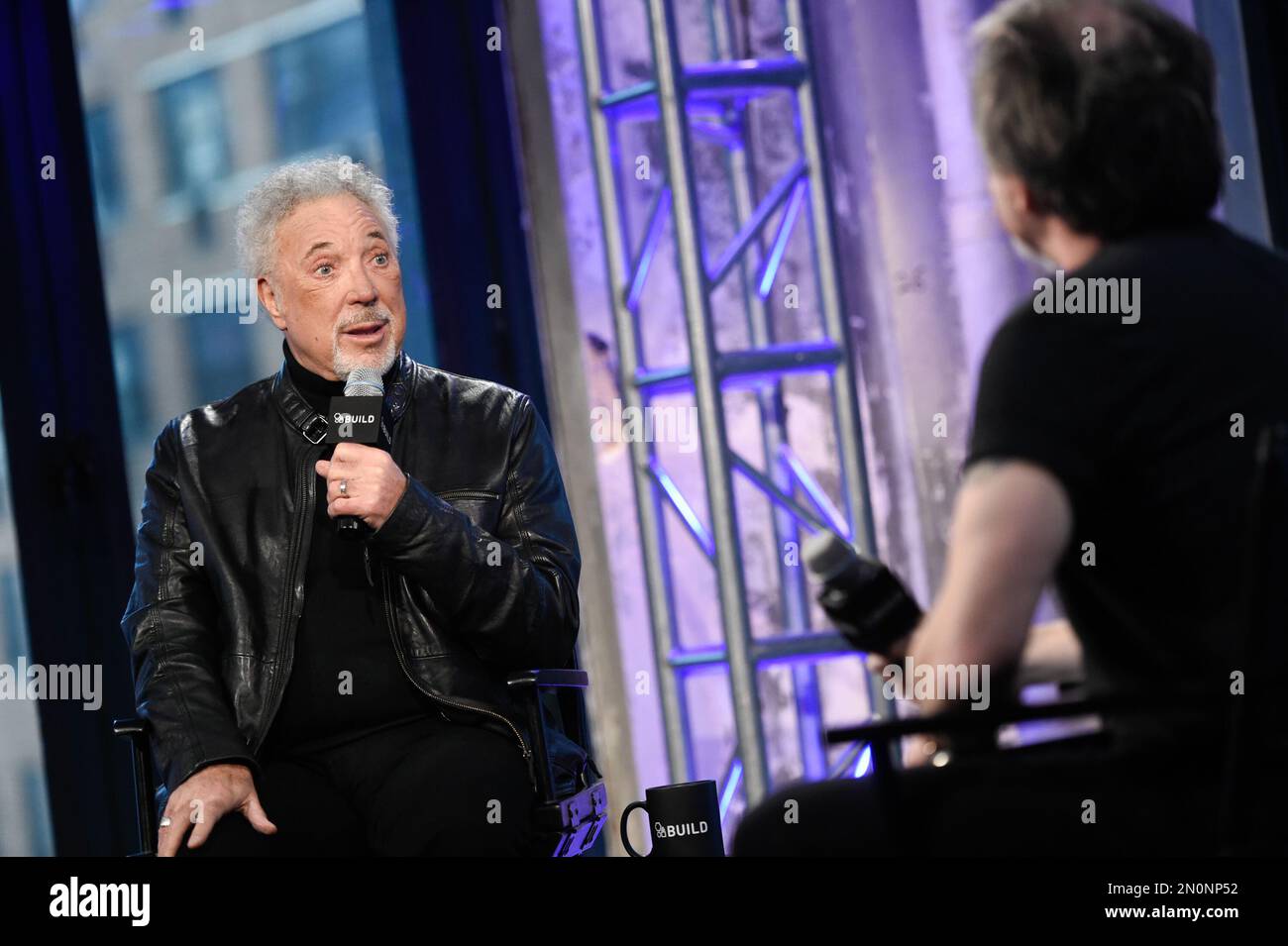 Singer Tom Jones, left, chats with moderator Brad Tolinski during AOL's ...