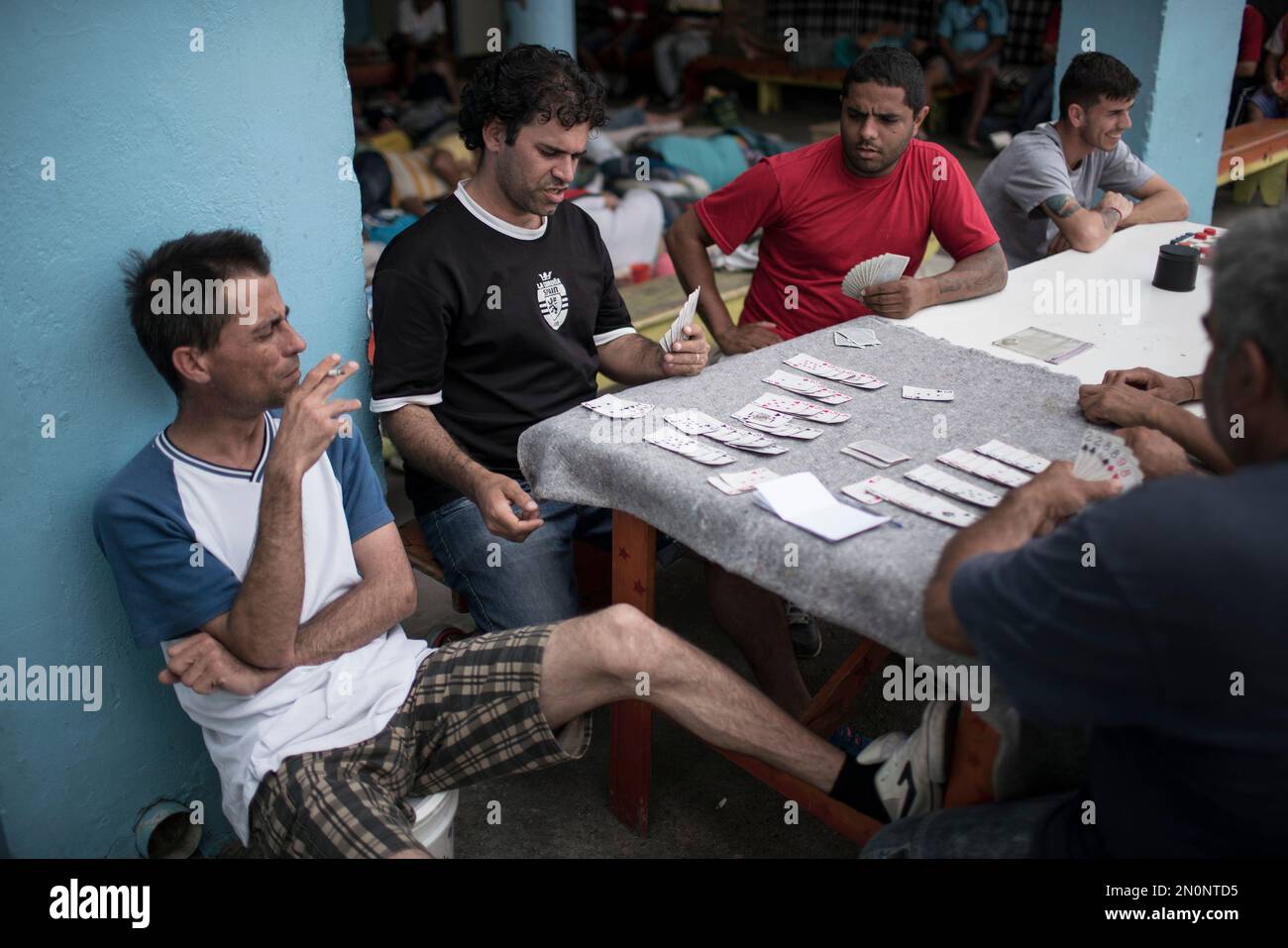 In this Dec. 1, 2015 photo, inmates play cards inside the patio of a ...
