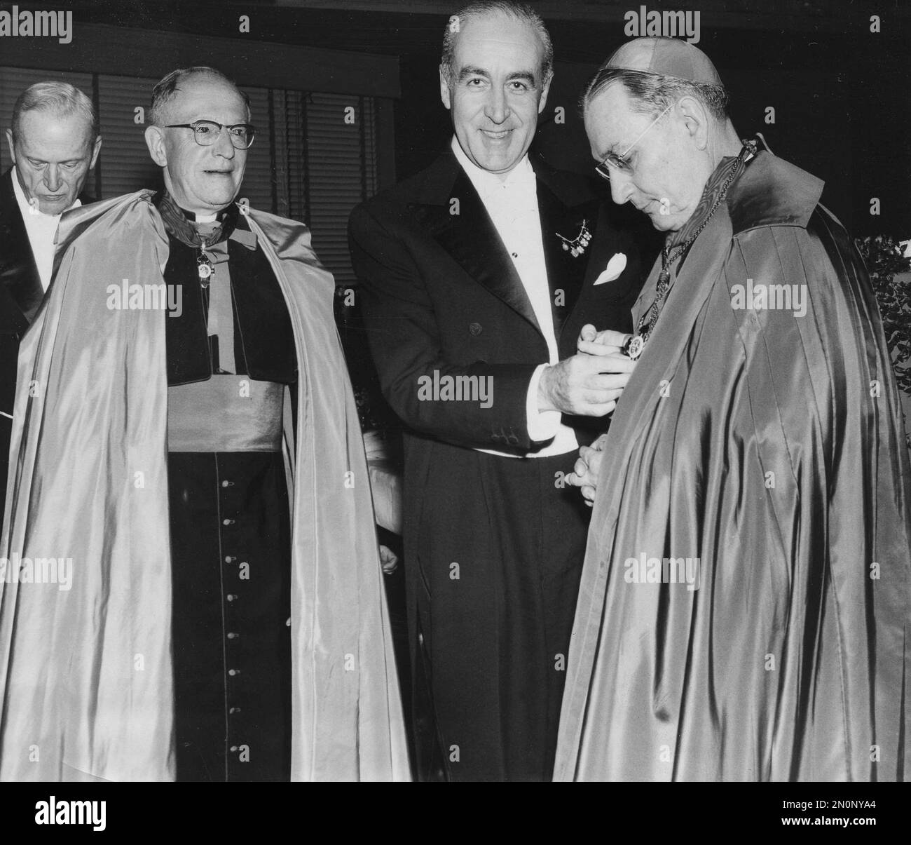 Bishop Sidney M. Metzger, right, receives the highest honor Spain every ...