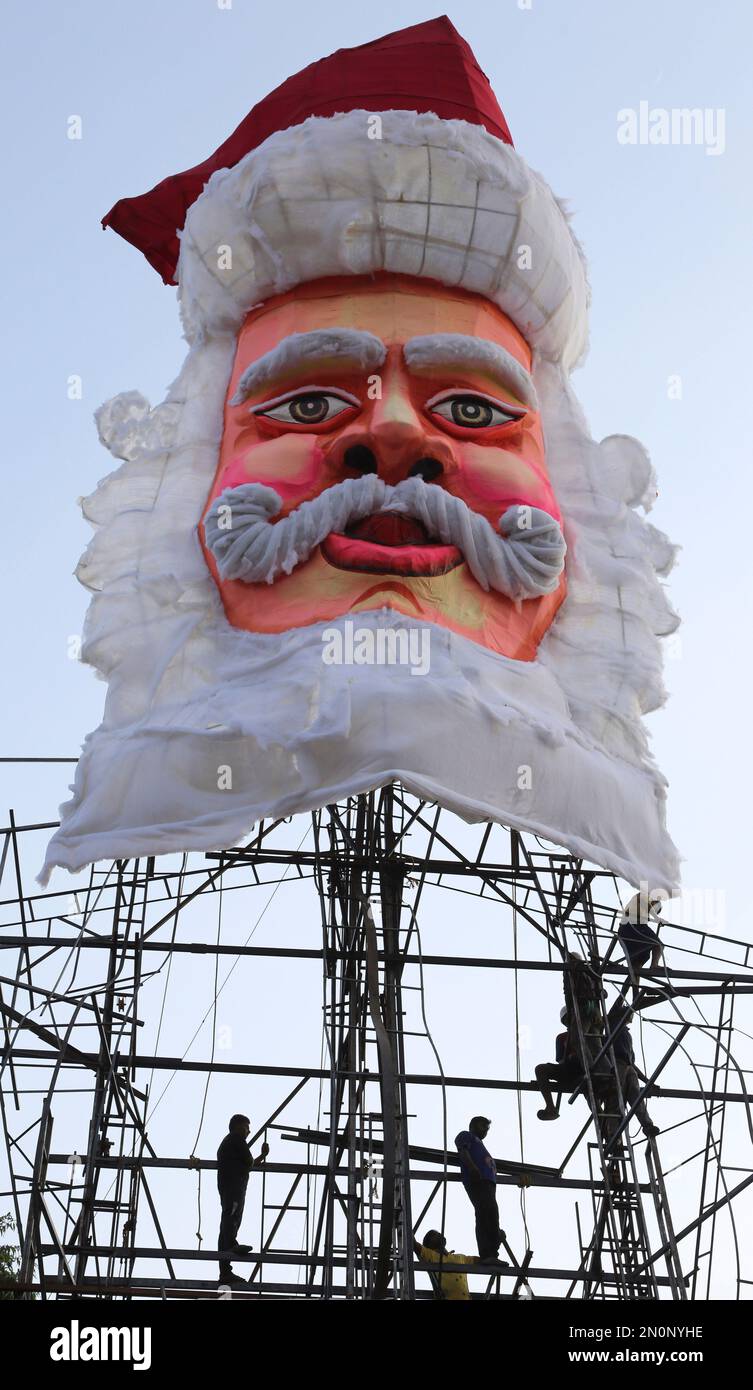 Indian workers make a larger than life size statue of Santa Claus in ...