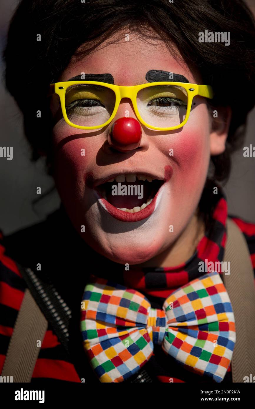 A clown poses for a portrait outside the Basilica of Our Lady of ...