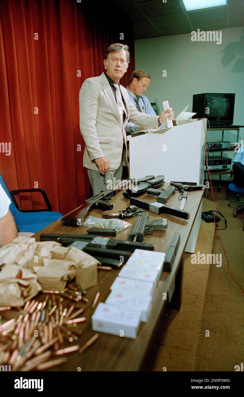 Dr. Richard Greathouse, Jefferson County coroner, stands over the ...