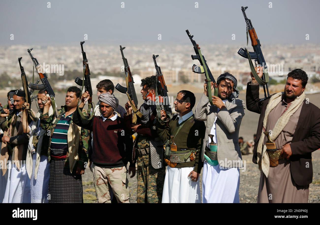 Shiite tribesmen, known as Houthis, hold their weapons during a tribal ...