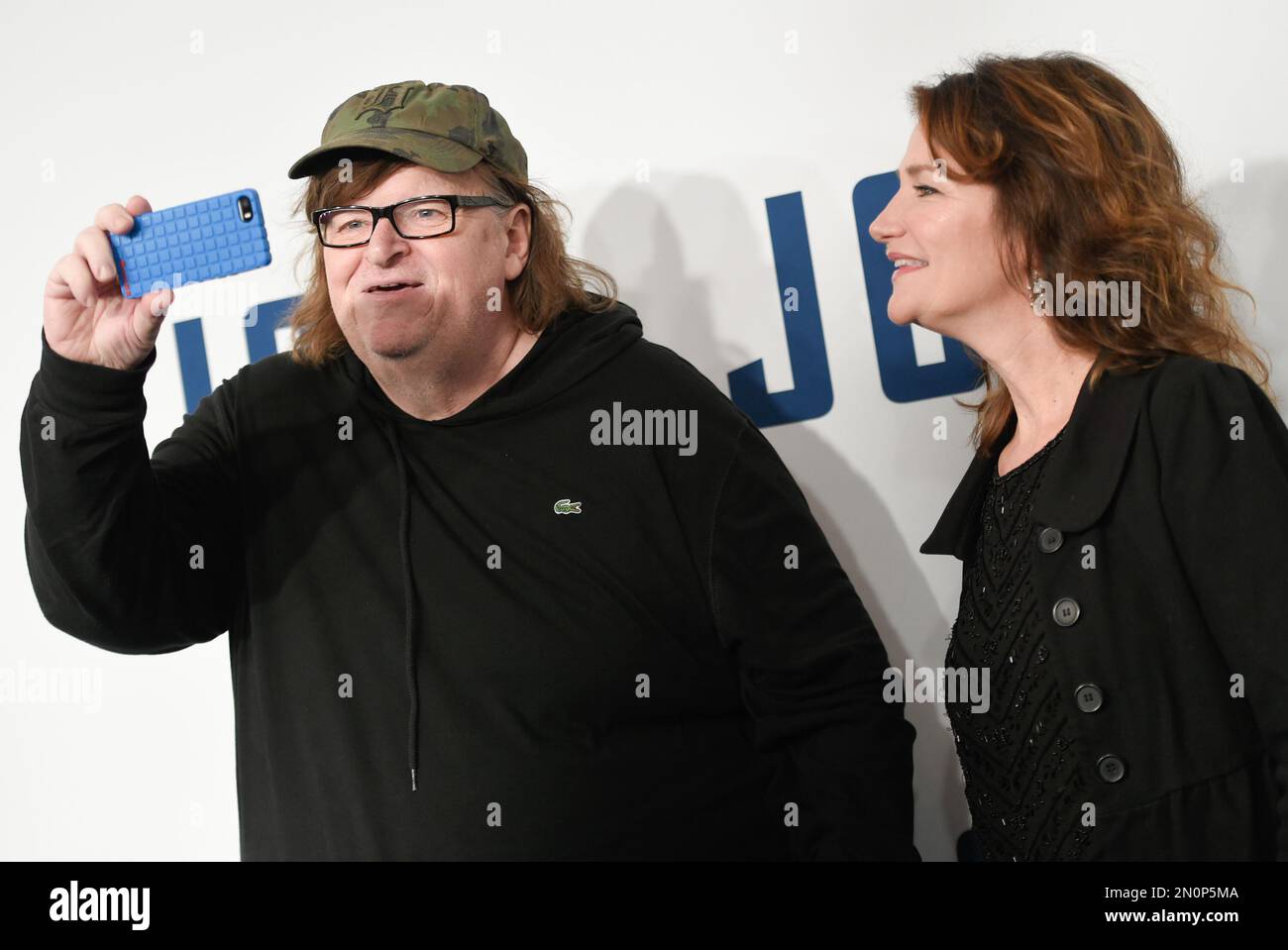 Director Michael Moore and guest attend the world premiere of "Joy" at ...