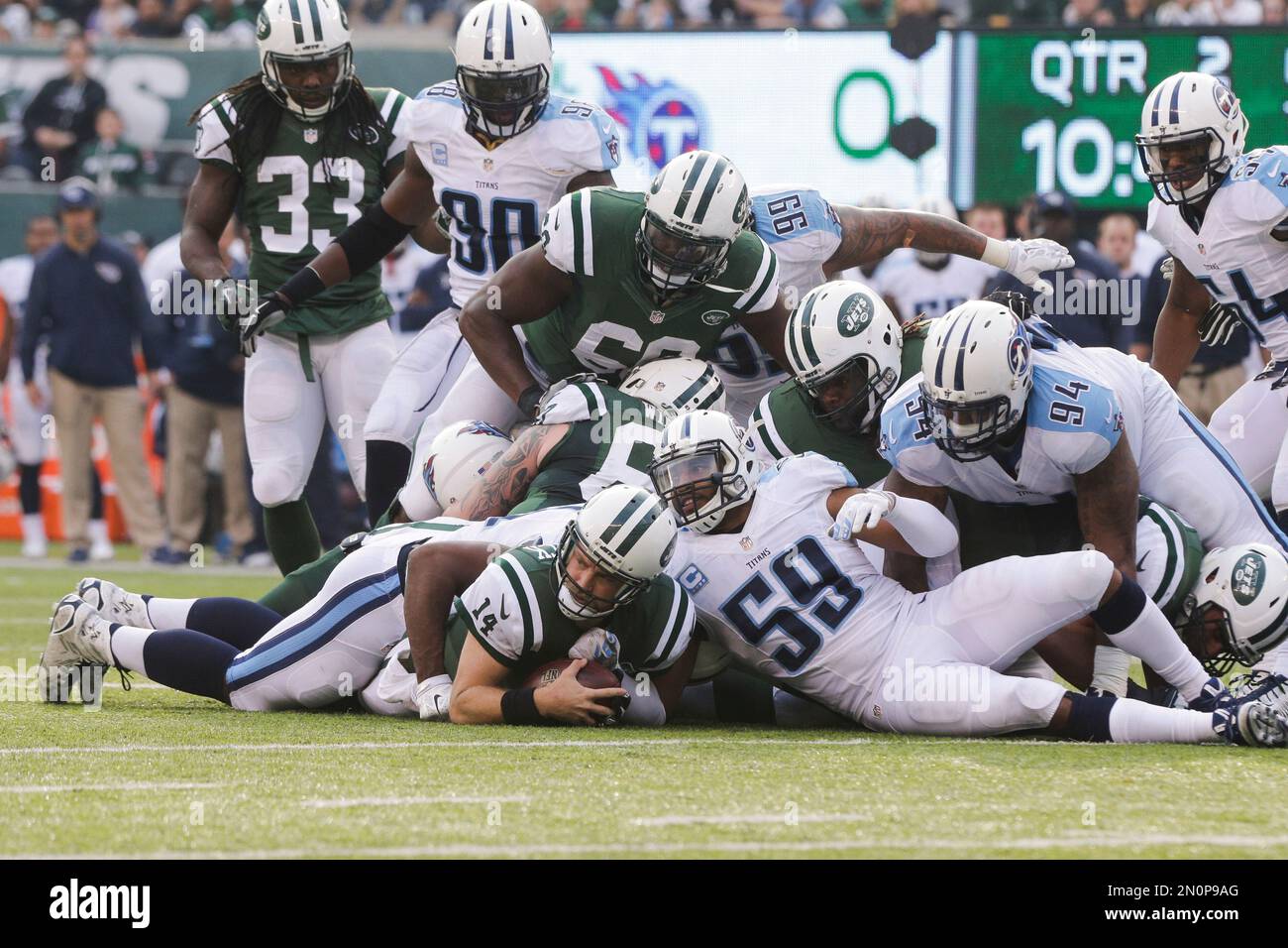 New York Jets quarterback Ryan Fitzpatrick (14) looks away after being ...