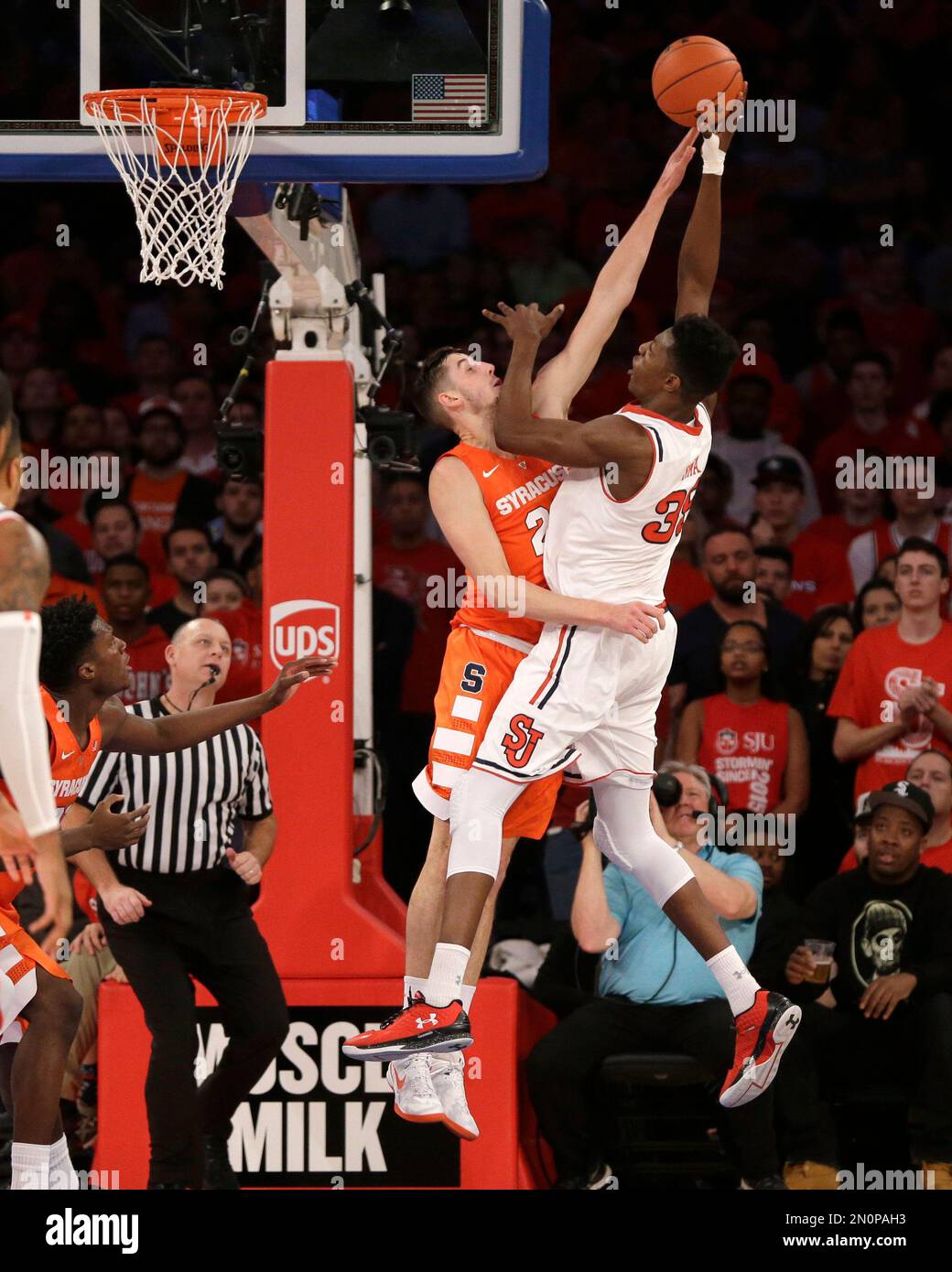 St. John's Yankuba Sima, right, shoots over Syracuse's Tyler Lydon ...