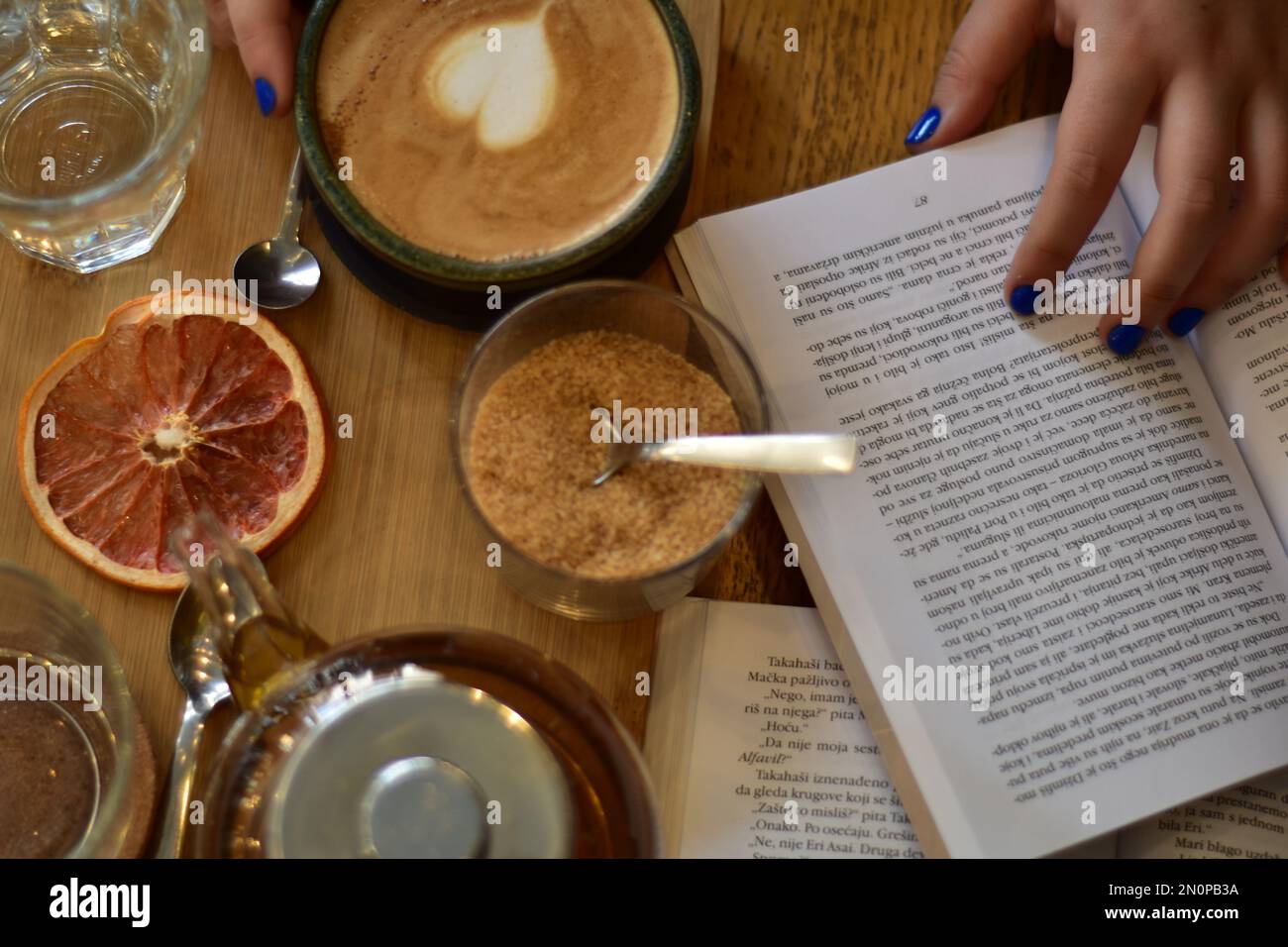 Moroccan tee and coffee on a wooden plate in a coffee shop with grape ...