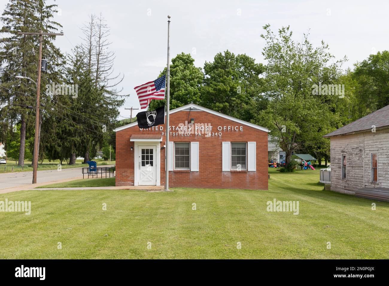 Rural US post office building, with an American flag flying Stock Photo ...