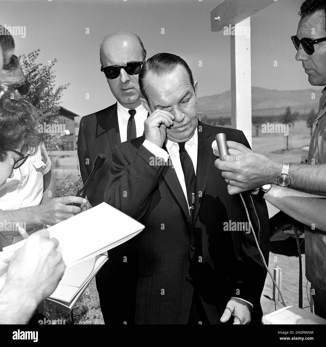 Western band leader Spade Cooley wipes a tear from his eye after ...