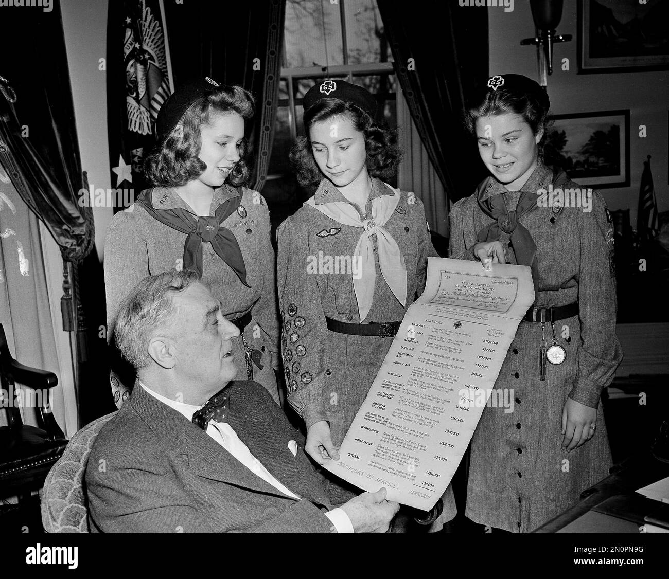 Three Girl Scouts, representing the 850,000 members of the organization ...