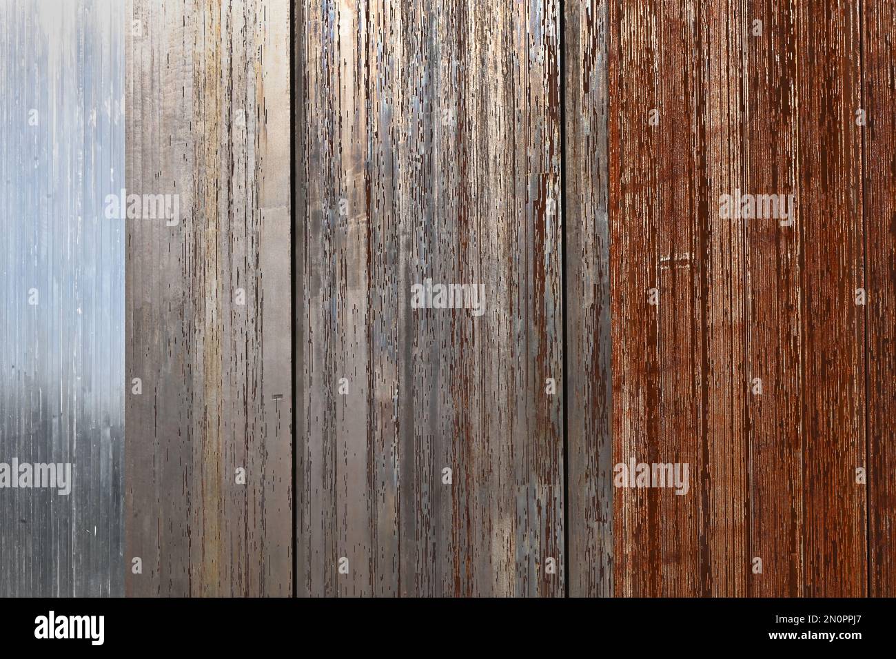 Weathered metal surface showing rust and aging texture in multi-colored ...