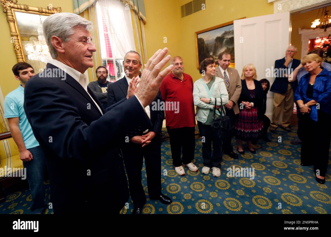 Mississippi Gov. Phil Bryant speaks to some members of the Temple Beth ...