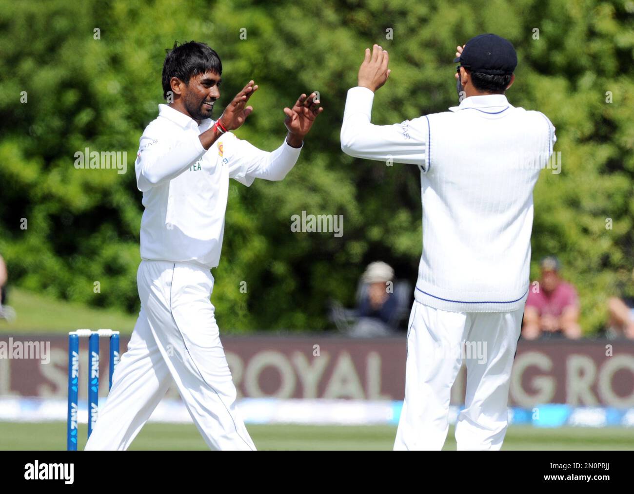 Sri Lanka’s Numan Pradeep, left, after dimissing New Zealand’s Neil ...