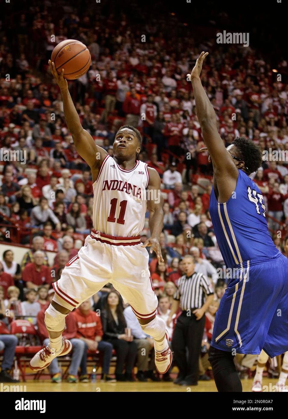 Indiana's Yogi Ferrell (11) puts up a shot against IPFW's Brent Calhoun ...
