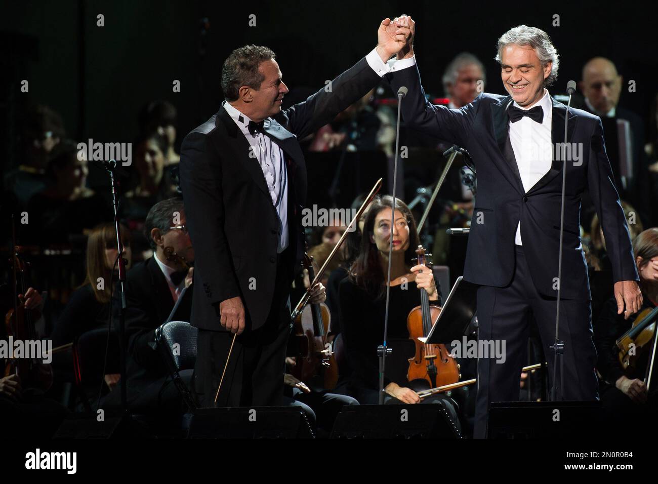 Andrea Bocelli, right, and conductor Eugene Kohn perform in concert to ...