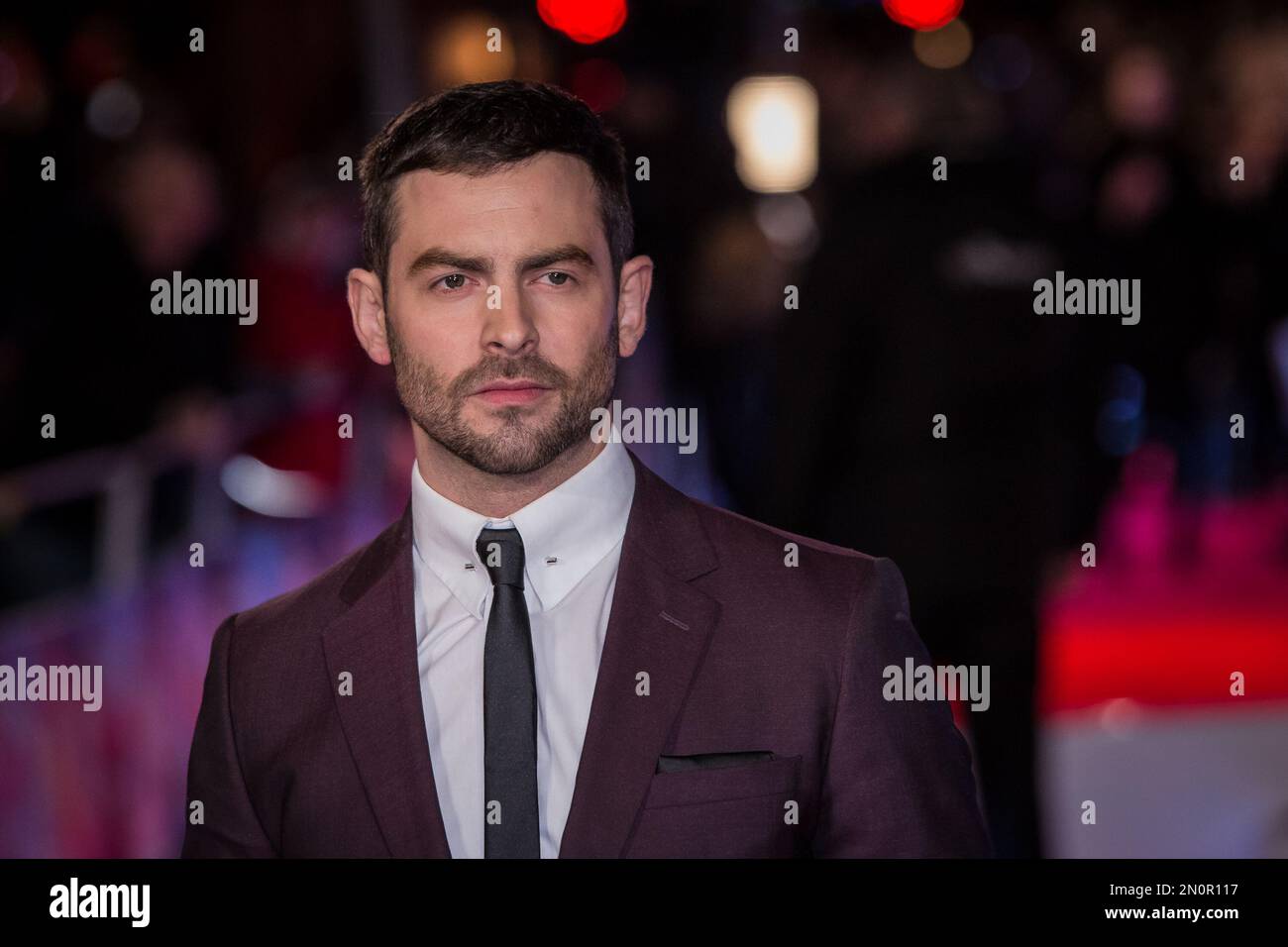 Cameron Moore poses for photographers upon arrival at the premiere of ...