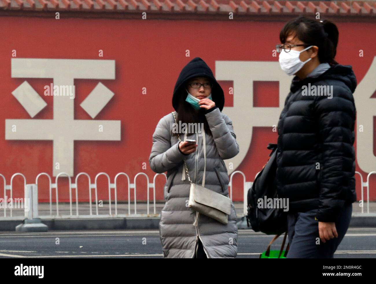 Residents wear mask for protection from smog during a day of heavy ...