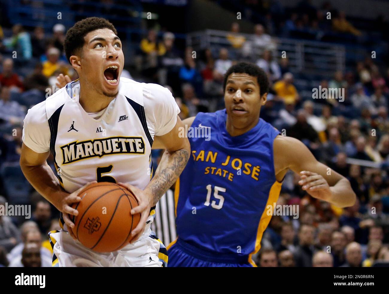 Marquette's Sandy Cohen III drives past San Jose State's Brandon Clarke ...