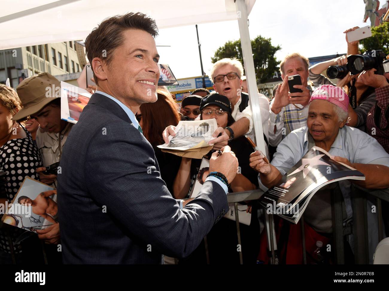 Actor Rob Lowe signs autographs for fans after receiving a star on the ...