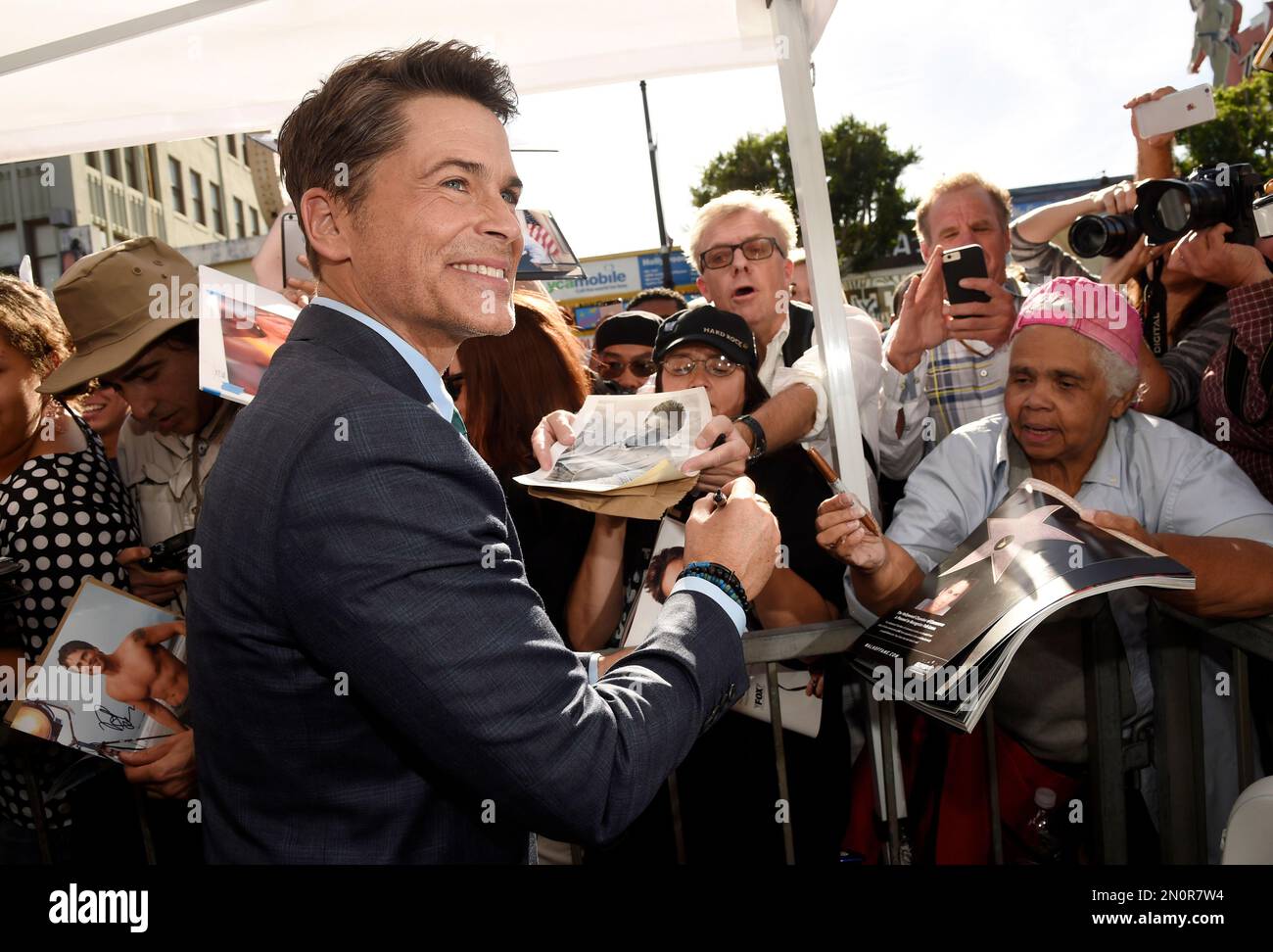 Actor Rob Lowe signs autographs for fans after receiving a star on the ...