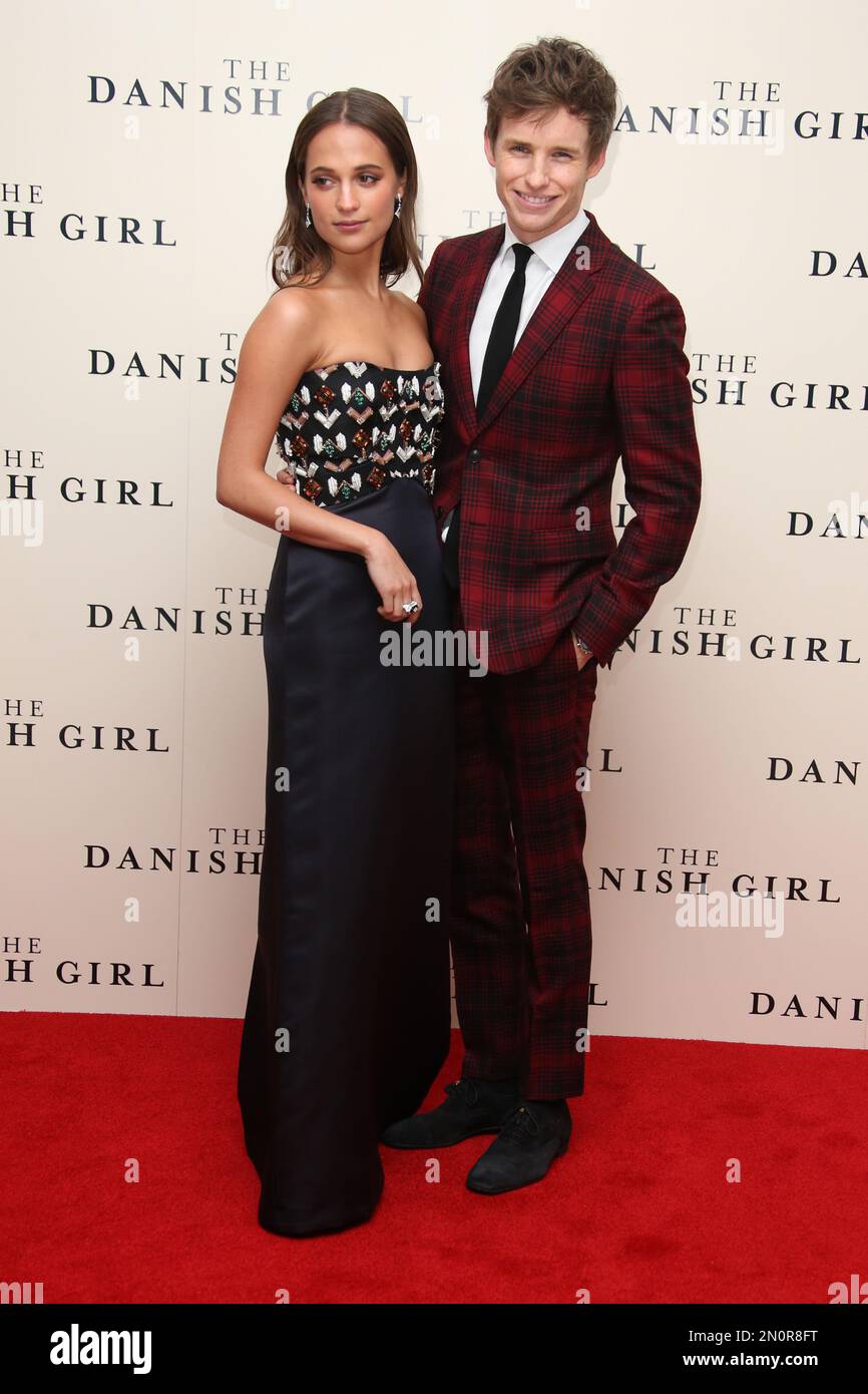 Alicia Vikander, left, and Eddie Redmayne pose for photographers upon ...