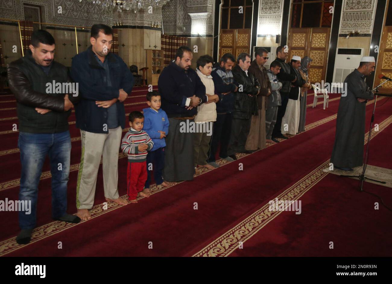Iraqi Muslims pray at a mosque in Baghdad, Iraq, Tuesday, Dec. 8, 2015 ...
