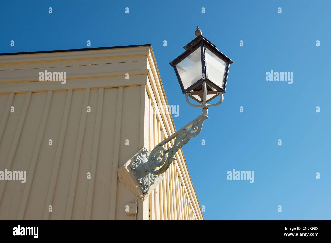 Old Street Light on a House corner Stock Photo - Alamy