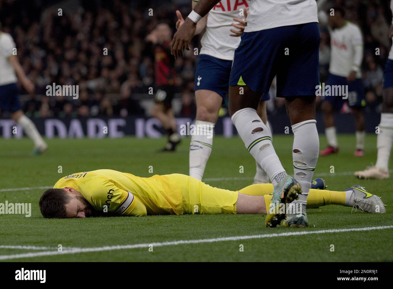 Hugo Lloris, the goalkeeper of Tottenham Hotspur lays on the pitch ...