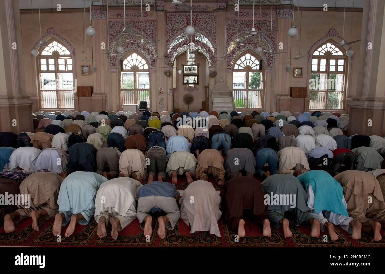 Pakistani Muslims offer afternoon prayer at Memon mosque in Karachi ...