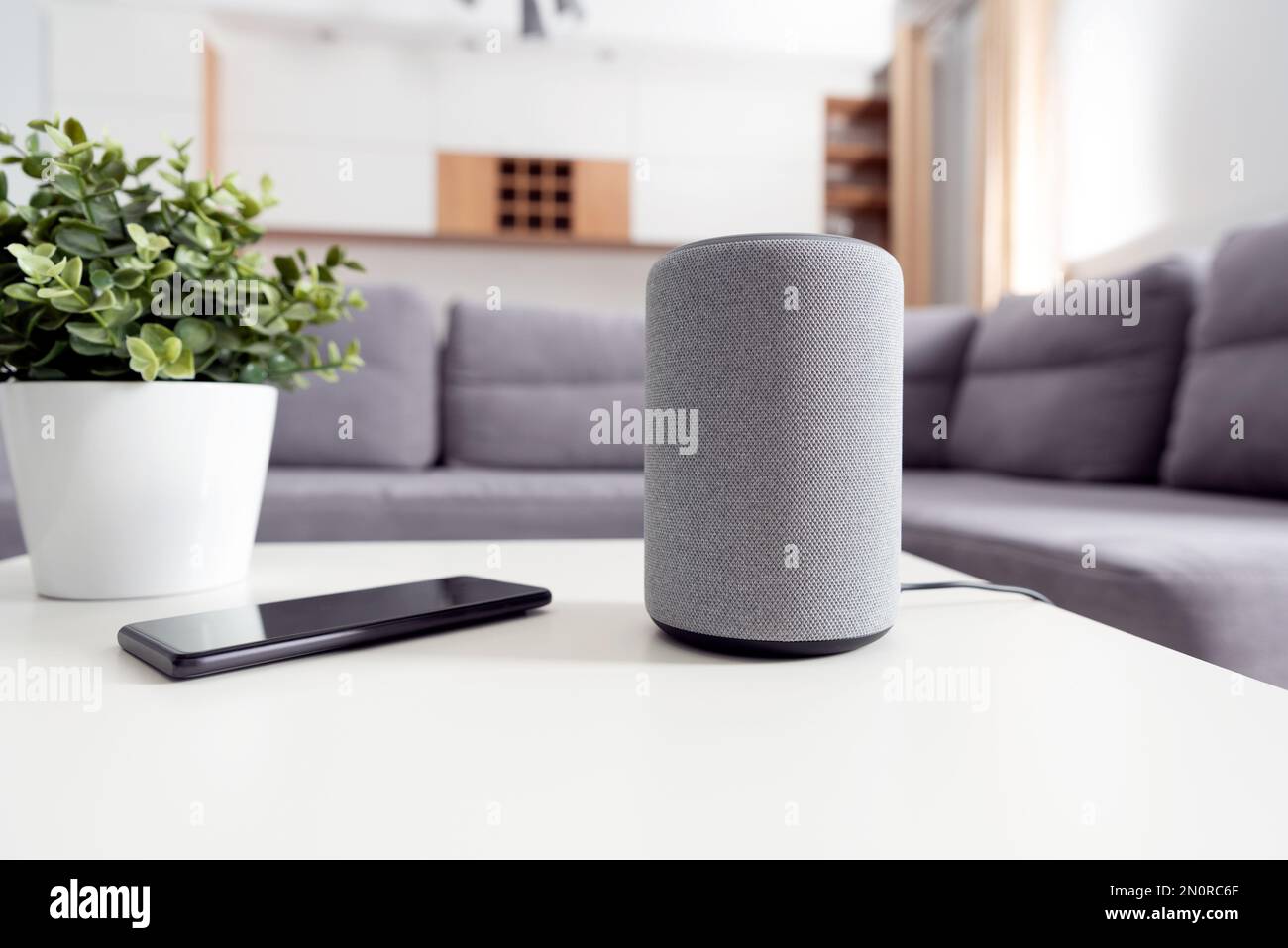 Smart speaker device in living room. Smart home system Stock Photo - Alamy