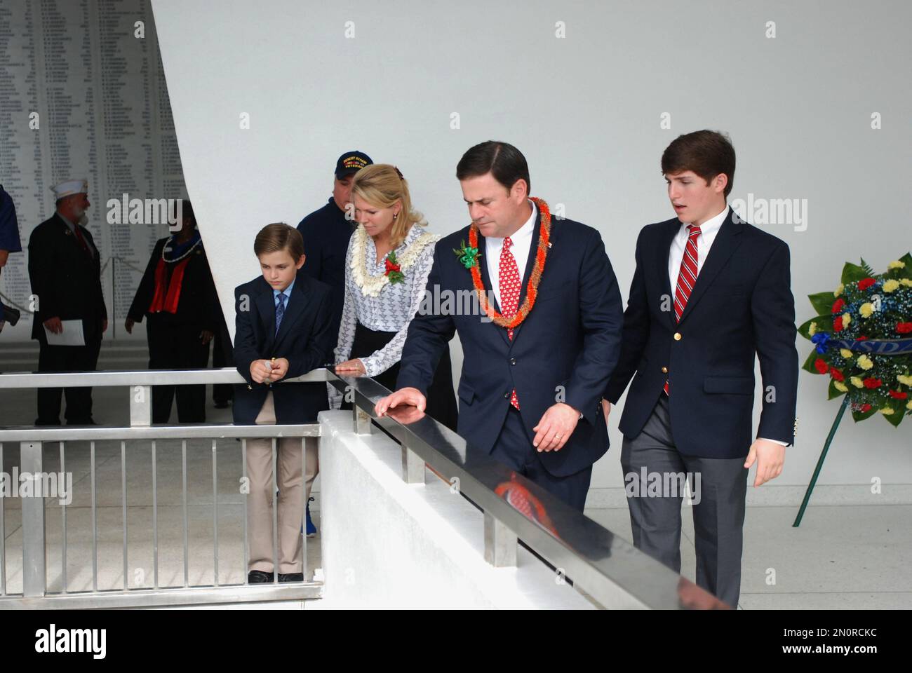 Arizona Gov. Doug Ducey, center right, looks at the submerged wreck of ...