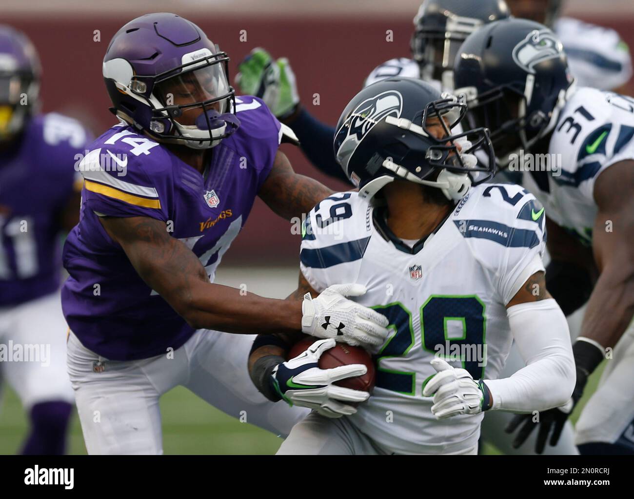 Seattle Seahawks free safety Earl Thomas (29) has his helmet turned a face mask by Minnesota ...