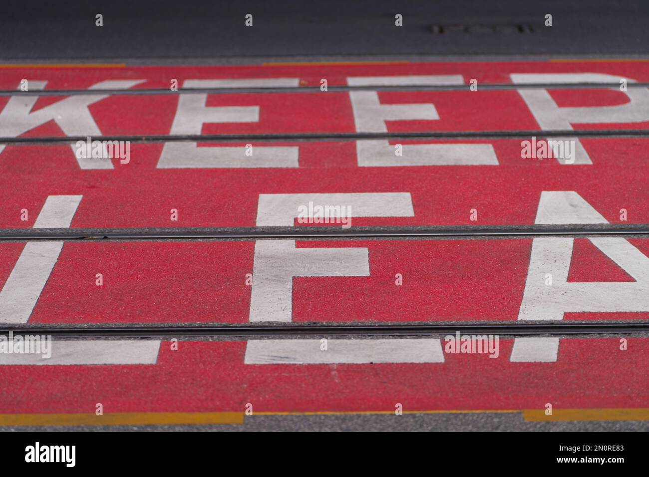 Keep clear information sign with red background and white lettering on ...