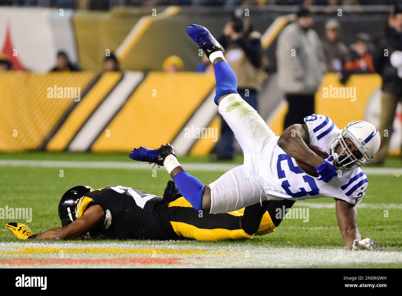 Indianapolis Colts running back Frank Gore (23) tumbles over Pittsburgh ...