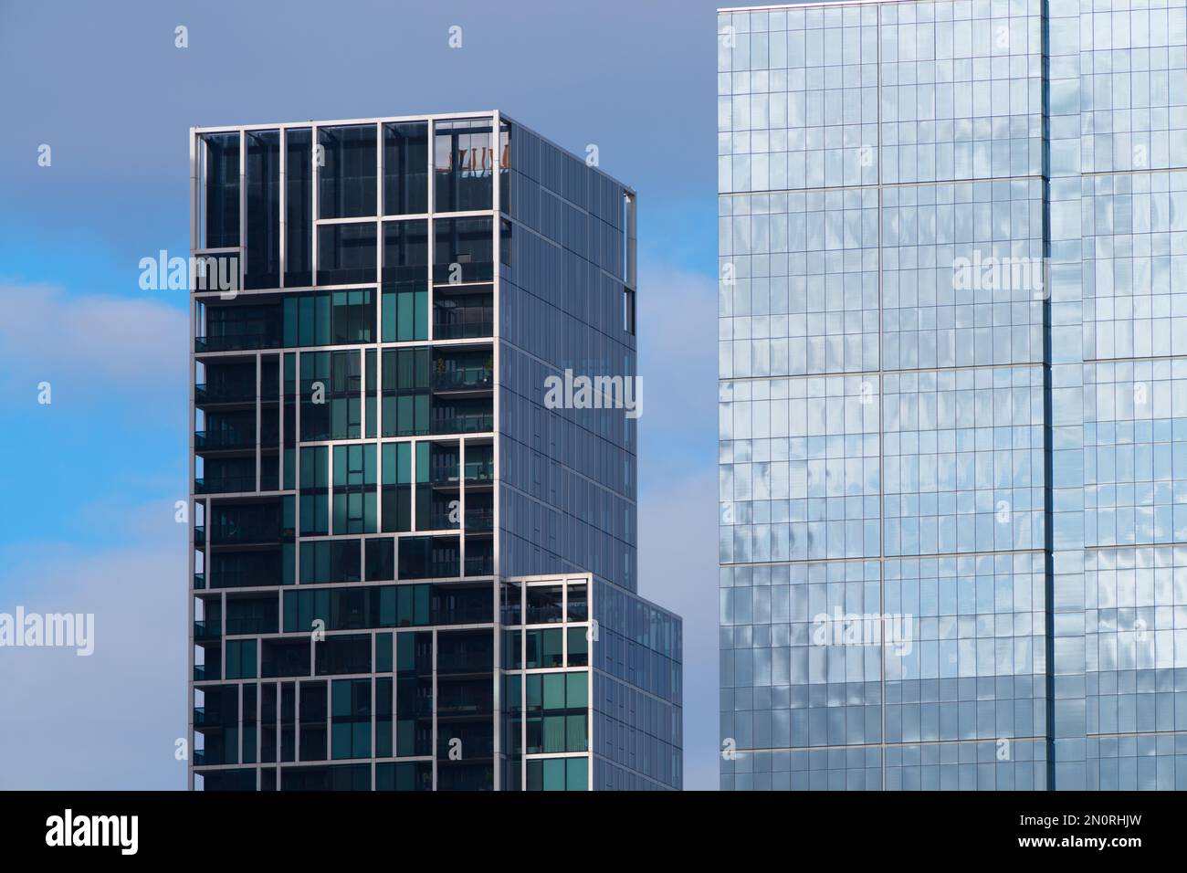 Modern city building apartment block with balconies, windows and glass ...