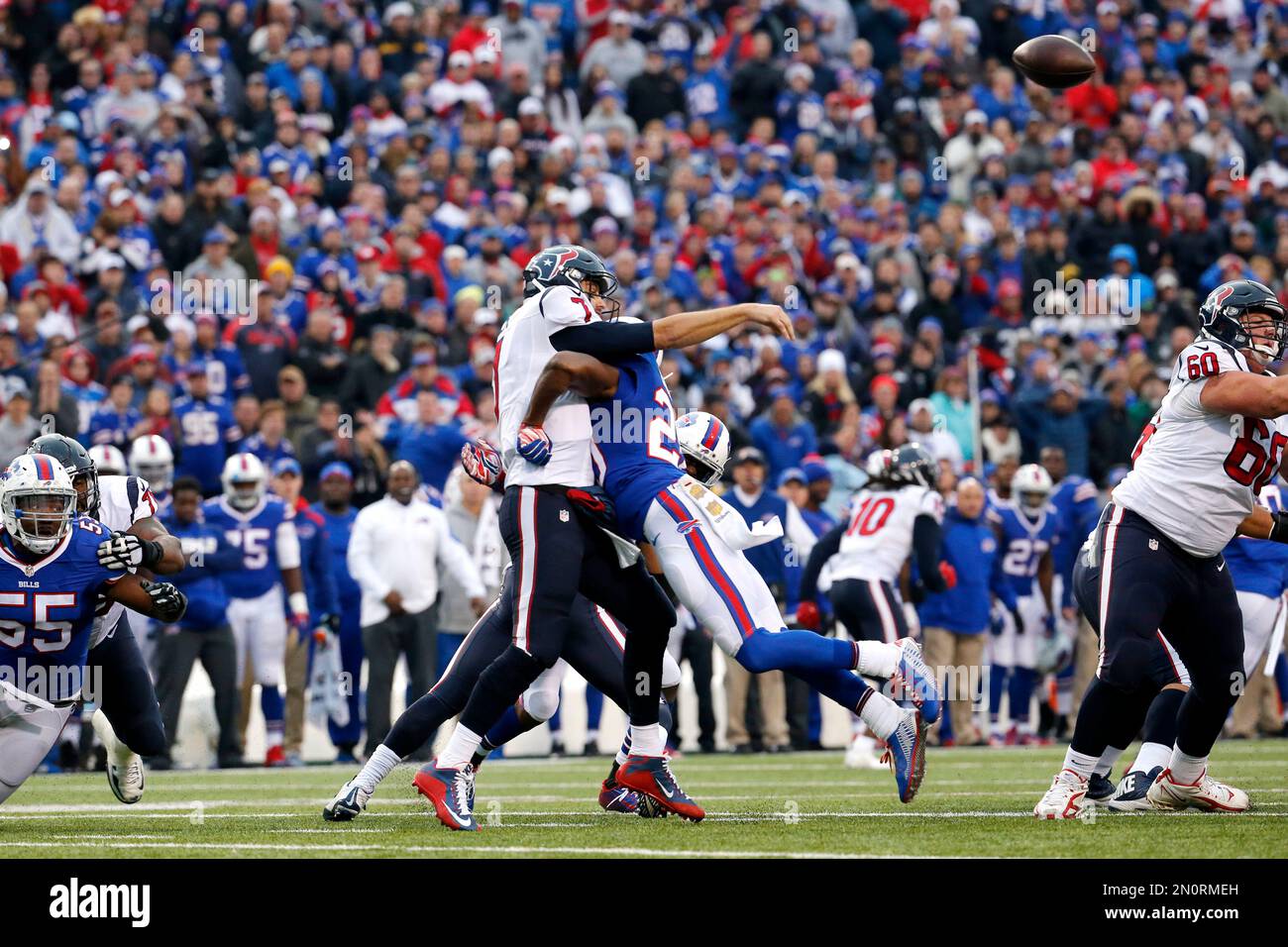Houston Texans quarterback Brian Hoyer, left, is hit by Buffalo Bills ...